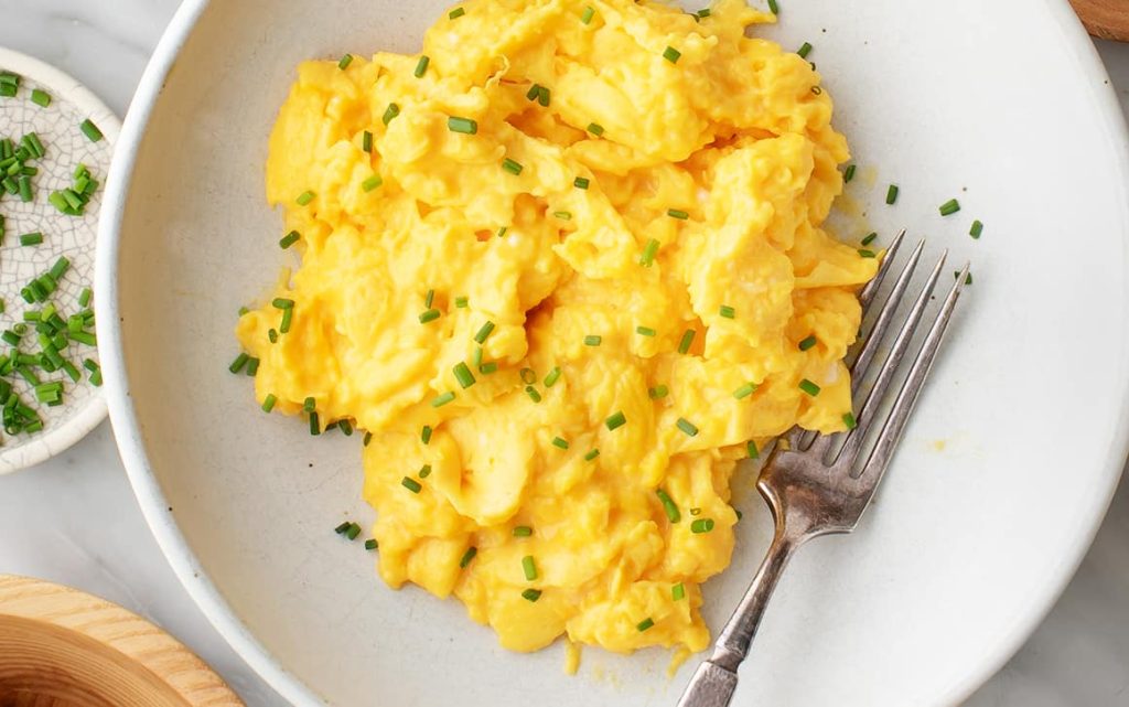 My mother-in-law usually puts milk in her scrambled eggs, but I don’t ...